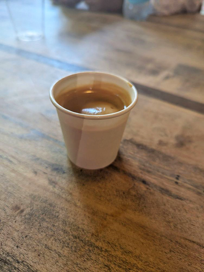 That tiny cup holds liquid ambition&mdash;the espresso that powers downtown Greensboro one caffeinated sip at a time. Small but mighty indeed.