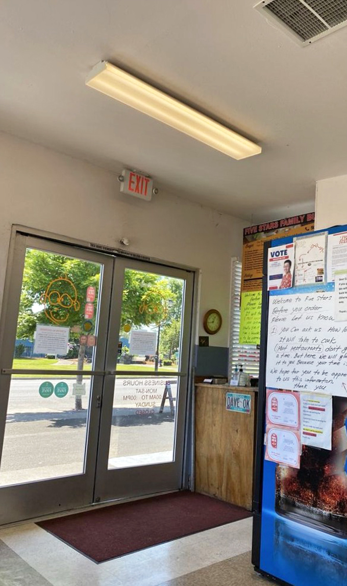 Even the exit sign seems to say, "You'll be back!" as sunlight streams through the windows of this humble burger haven.