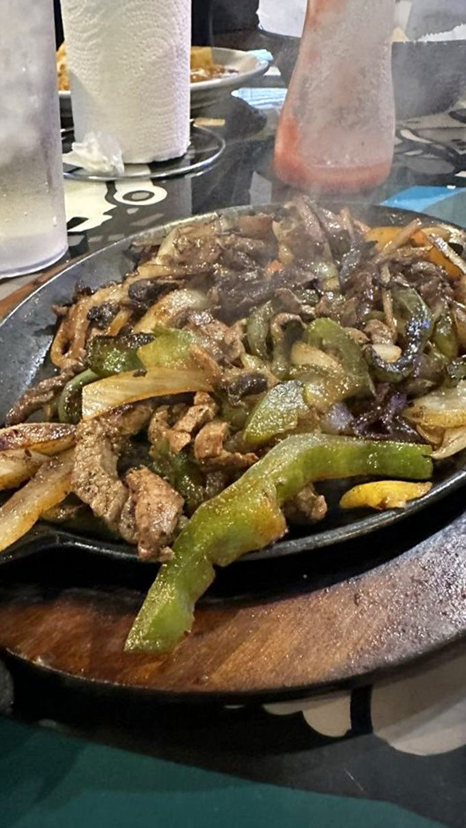 The sizzle announces its arrival before you see it. This fajita platter doesn't just satisfy hunger&mdash;it creates memories.