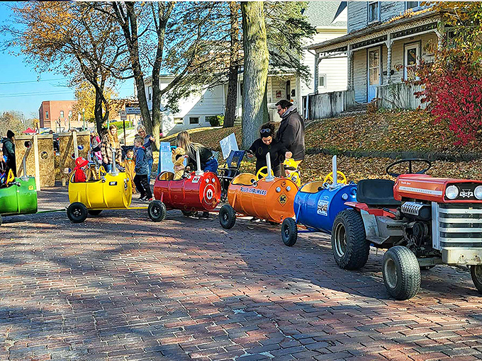 These colorful homemade train cars aren't just children's rides&mdash;they're childhood magic on wheels, rolling down brick streets during festival season.