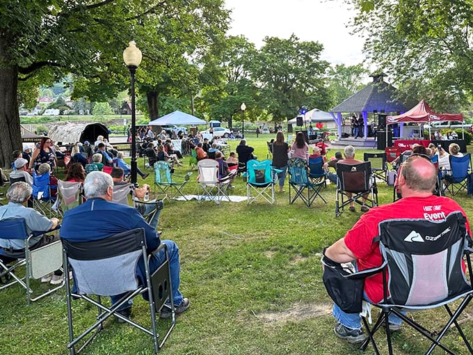 Community gatherings in riverside parks create the kind of connections that make small towns feel like home.
