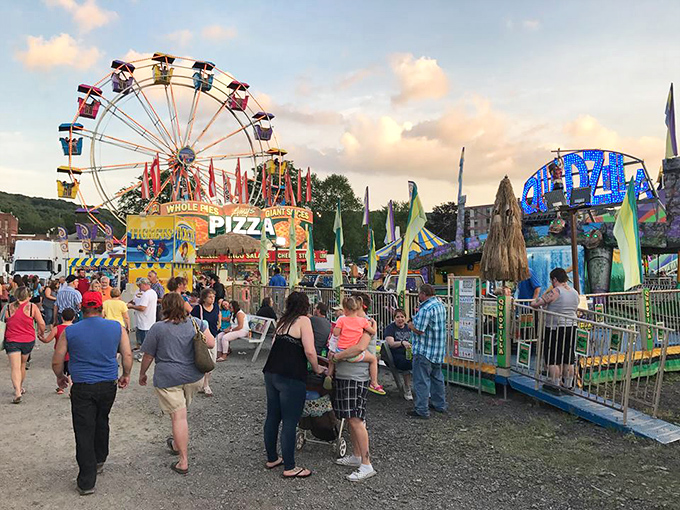 Small-town festivals turn ordinary evenings into technicolor memories. That Ferris wheel isn't just giving rides—it's offering perfect snapshots of childhood that parents will remember long after the cotton candy is gone.