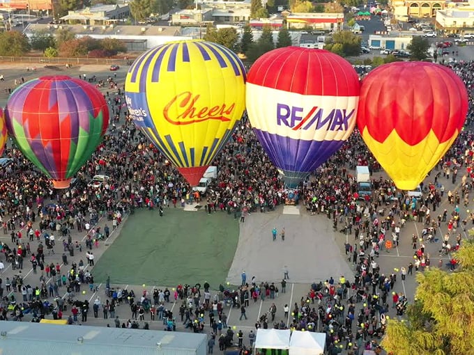 The balloon festival brings a kaleidoscope of color to Clovis skies, drawing crowds who tilt their heads skyward in collective wonder at these gentle giants.