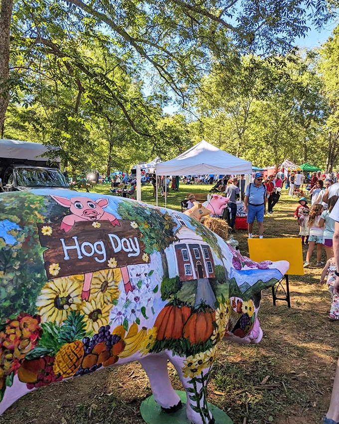 Hog Day festivities bring the community together with colorful pig statues, local vendors, and enough barbecue to make vegetarians reconsider their life choices.
