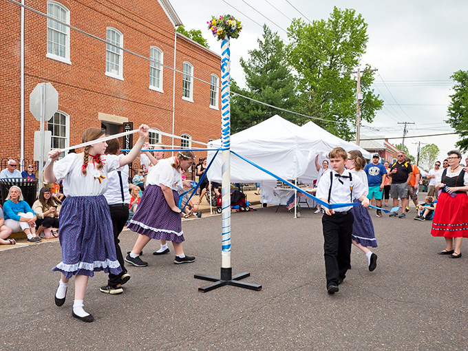 Traditional maypole dancing&mdash;where coordination meets celebration and spectators get to enjoy both the cultural display and occasional entertaining missteps. German heritage in motion!