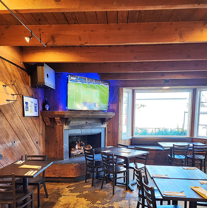 Wooden beams, a crackling fireplace, and sports on TV&mdash;proof that comfort and coastal charm can coexist in perfect harmony.