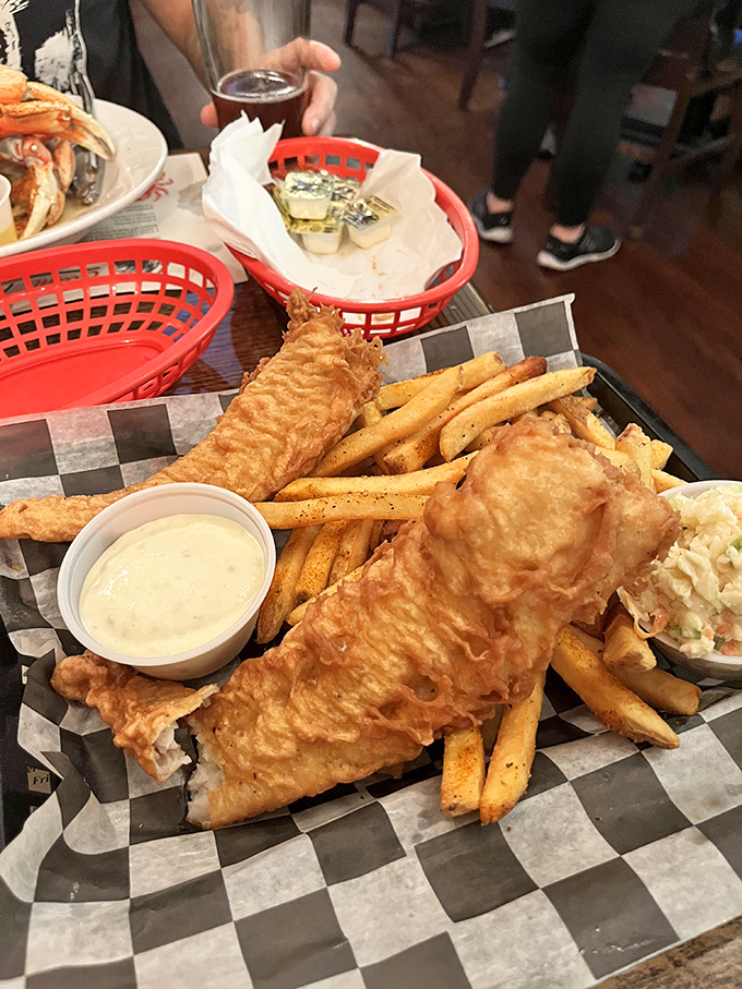 Fish and chips that would make a British pub proud, with golden batter so light and crisp it practically floats above the plate.