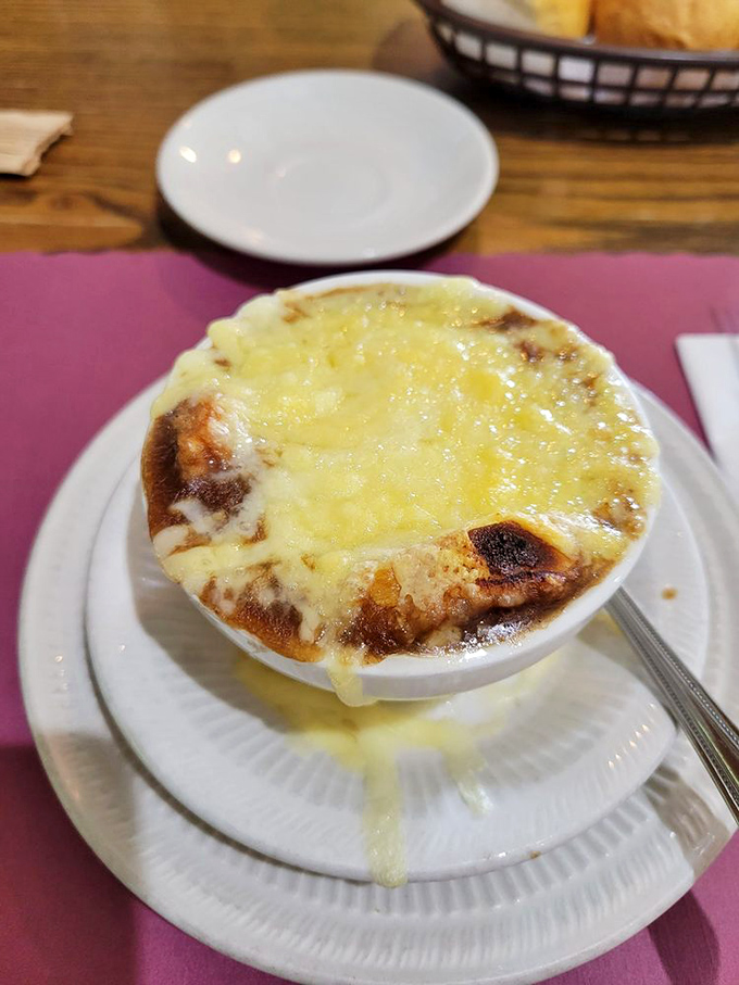 French onion soup so good it should have its own passport. That melted cheese cap is the roof over a house I want to live in.