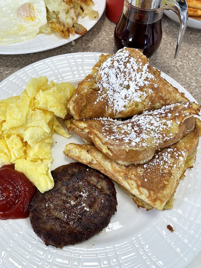 French toast that puts ordinary bread to shame, dusted with powdered sugar and flanked by eggs and sausage. Breakfast of champions&mdash;and everyone else.