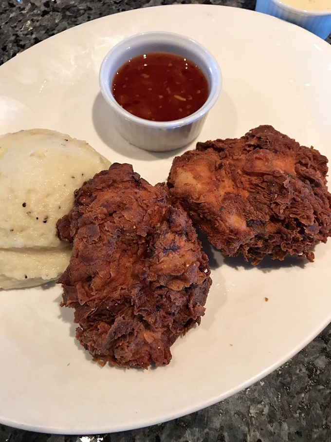 Fried chicken that's achieved that mythical balance – shatteringly crisp outside, juicy inside. Those mashed potatoes are just waiting for their moment in the spotlight.