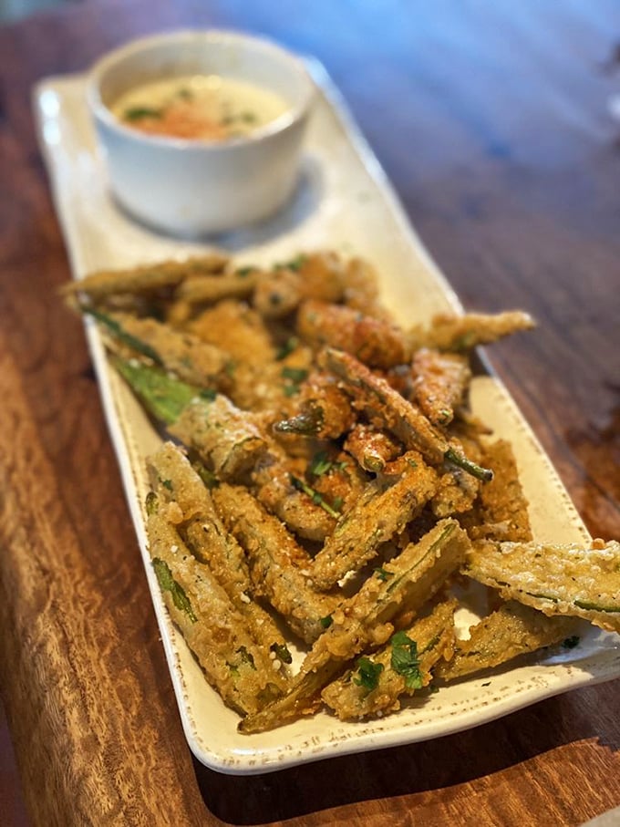 Fried okra that banishes all memories of the slimy stuff from school cafeterias. Crispy, seasoned perfection with a dipping sauce worth double-dipping. 