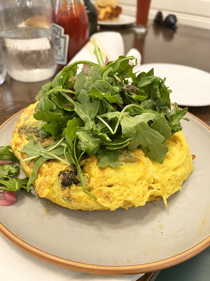 This frittata topped with fresh arugula is what happens when breakfast gets dressed up but keeps its comfortable shoes on.