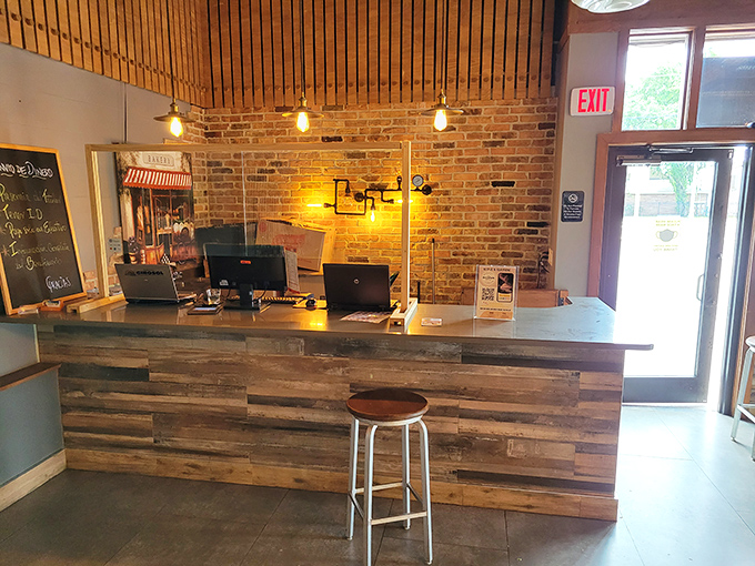 The counter's rustic wood paneling and exposed brick create a welcoming command center where pastry dreams come true and coffee wishes are granted.
