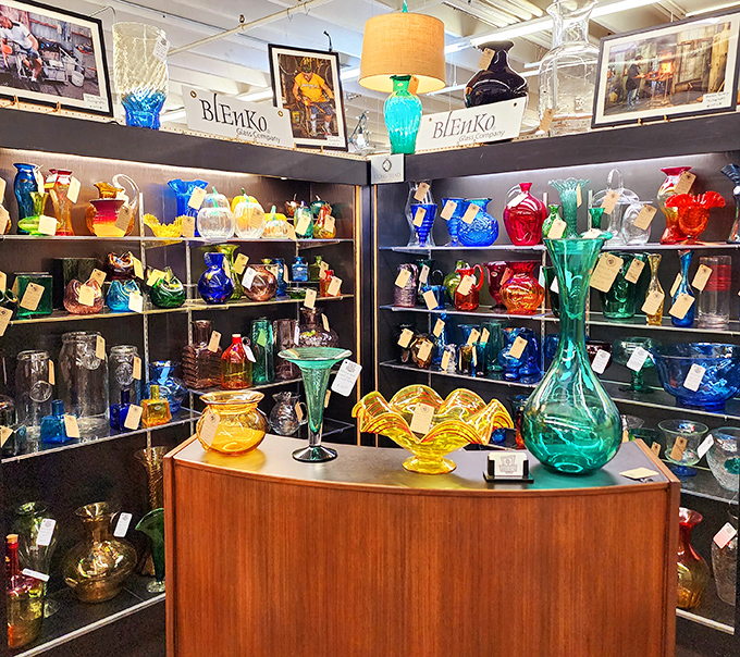 The Blenko glass collection glows like jewels under the lights. These aren't just vases&mdash;they're liquid sunshine captured in mid-pour decades ago.