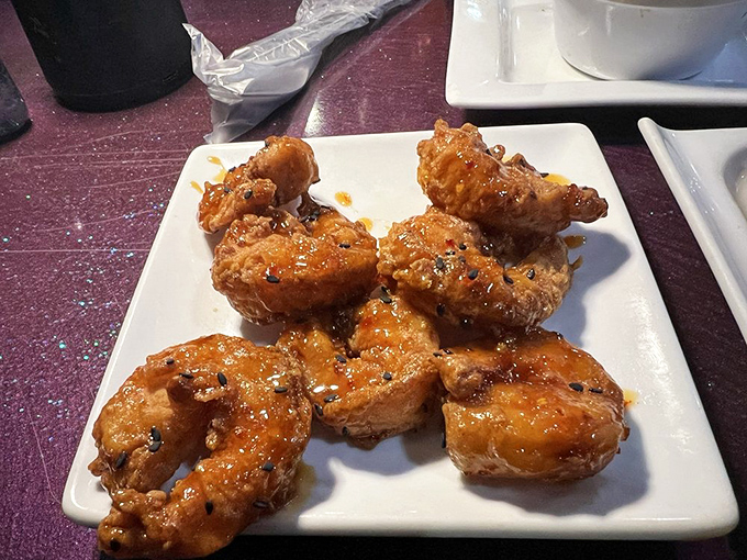 These glazed shrimp glisten with a sauce so good you'll be contemplating whether licking the plate is socially acceptable.