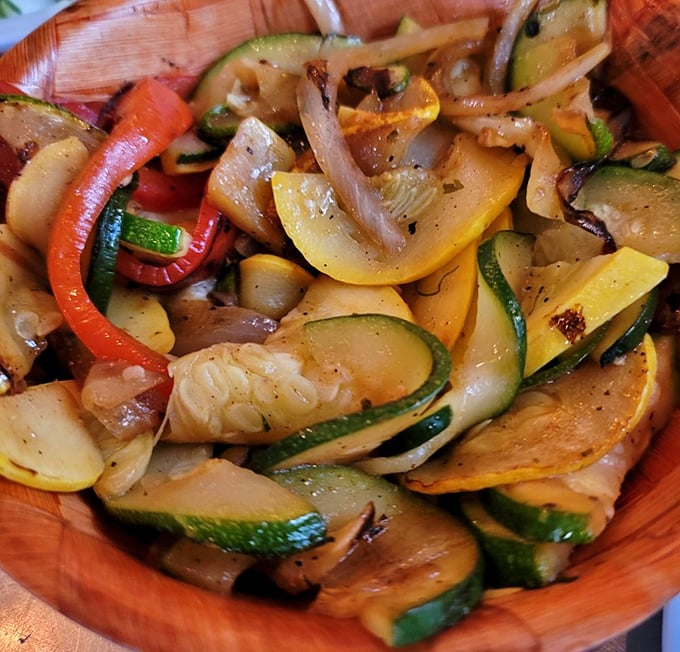 Even the vegetables get star treatment here &ndash; a colorful medley of grilled goodness that might actually steal attention from your main course.