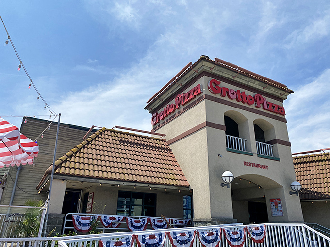 Grotto Pizza stands tall in Dewey's culinary landscape, a swirly-cheese institution where vacation calories don't count.