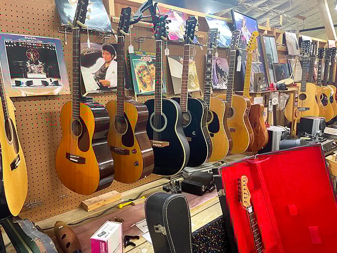 A wall of musical possibility &ndash; vintage guitars hang like art pieces, each one holding somebody's "Stairway to Heaven" or "Free Bird" dreams.