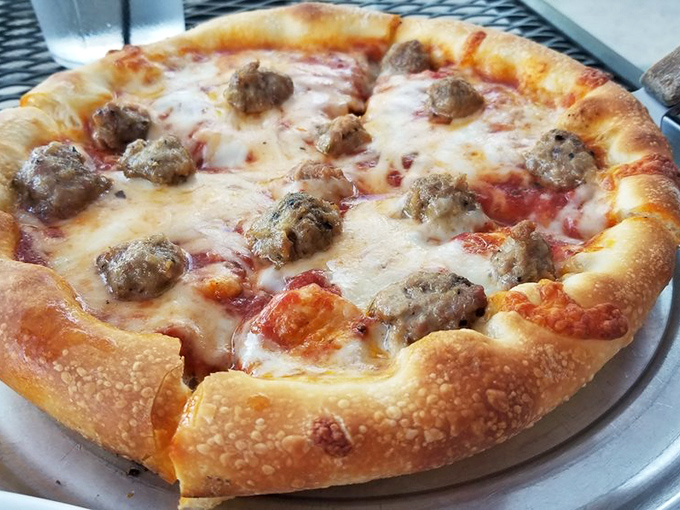 The sausage pizza that launched a thousand "just one more slice" promises. Perfectly distributed toppings on a canvas of cheese and sauce&mdash;edible artwork.