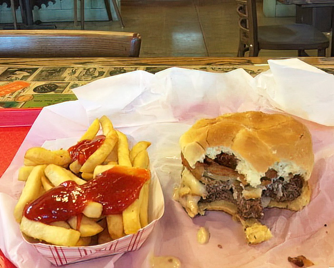 A burger with such honest presentation, it makes fast-food ads look like pathological liars. That bite mark tells the whole delicious story.