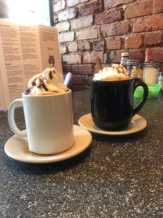 When coffee needs dressing up, Thumbs Up delivers with whipped cream mountains that turn ordinary beverages into morning celebrations.