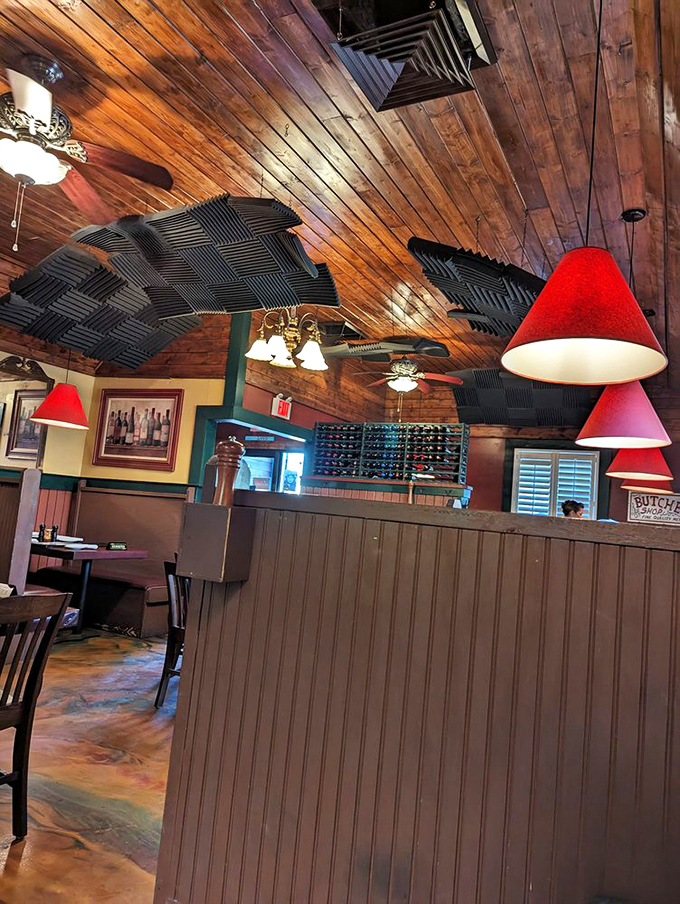 Wooden ceiling, acoustic panels, and those signature red lamps&mdash;someone understood that ambiance shouldn't compete with what's on your plate.