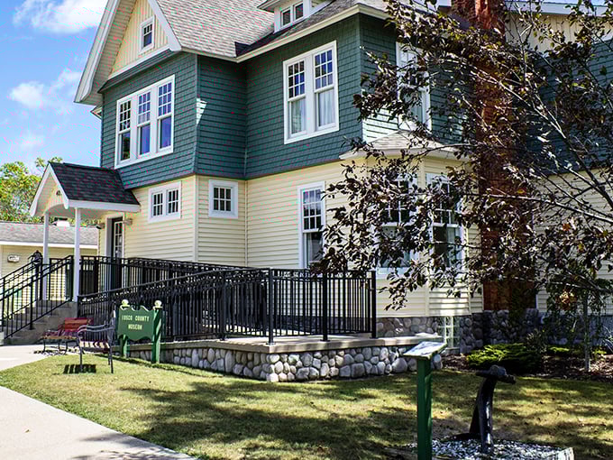 This historic yellow and green home serves as the Iosco County Historical Museum. Its welcoming porch seems to say, "Come sit a spell and hear some tales."