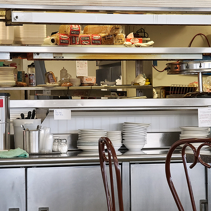 Behind every great breakfast is a kitchen that means business. Those stacked plates are like soldiers awaiting their marching orders.