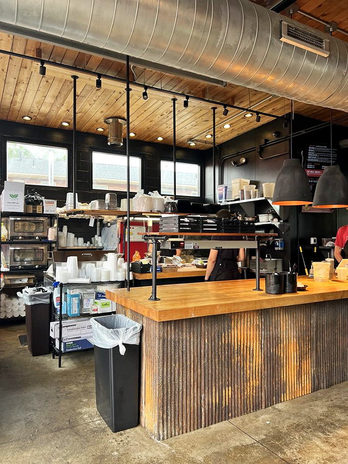 The kitchen's industrial-meets-rustic vibe isn't for show&mdash;it's the workshop where smoke and time transform the ordinary into the extraordinary. 