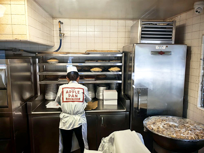 Behind the scenes, where the magic happens &ndash; pies cooling on racks while staff members maintain traditions older than most Hollywood franchises.