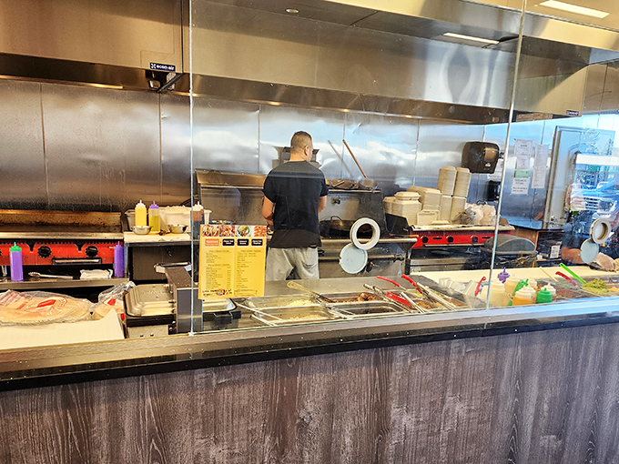 Behind the scenes where flavor is born. The kitchen's organized chaos is a symphony of sizzles and spices orchestrated by dedicated culinary conductors.