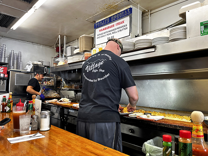 Kitchen choreography in action. These breakfast ballet dancers have flipped more eggs than most people have had hot meals.