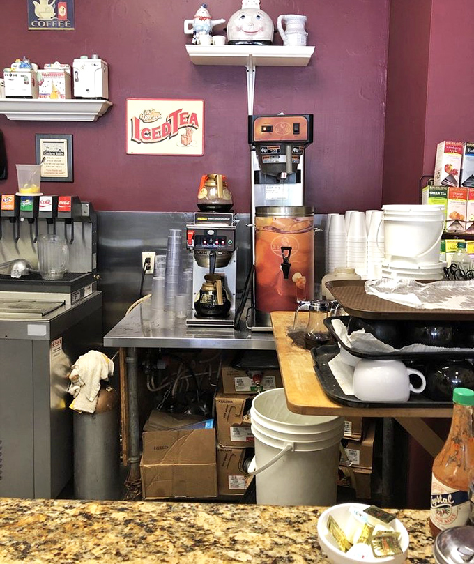 The coffee station&mdash;sacred ground in any respectable breakfast joint. That vintage Iced Tea sign isn't just decor; it's a promise of refreshment. 