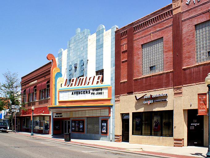 The Lamar Theatre's neon marquee lights up Main Street with retro charm. Where movie tickets still cost less than a fancy coffee in Denver.