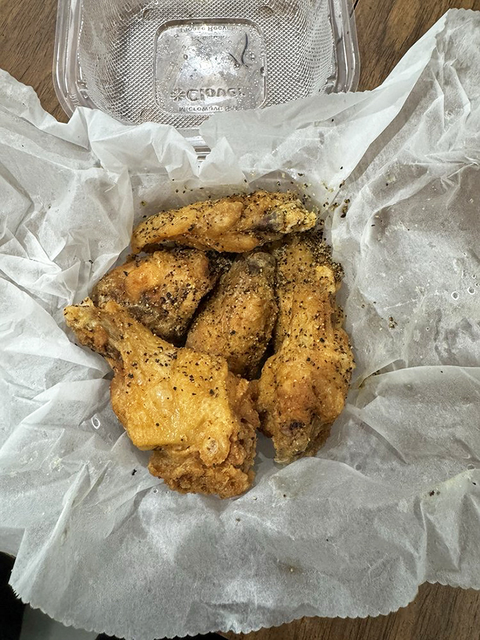 Lemon pepper wings that look so perfectly seasoned, you can practically taste the bright citrus zing cutting through the savory, peppery coating.