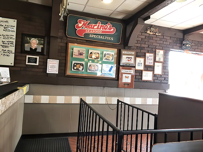 The wall of memories tells stories of satisfied customers past. Each frame a testament to decades of seafood excellence in Columbus.