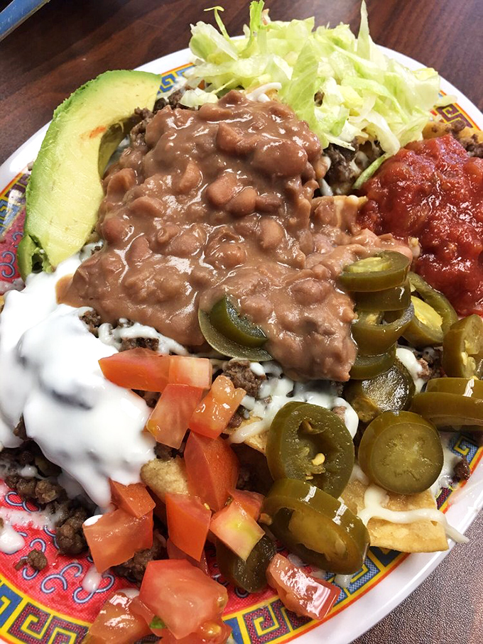 Nachos elevated from snack to main event&mdash;a topographical map of flavor with peaks of beans, valleys of cheese, and a landscape worth exploring.