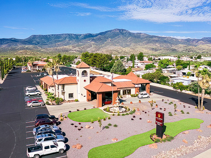 The Lux Verde stands as a Mediterranean-inspired oasis against the dramatic backdrop of Verde Valley's mountains.