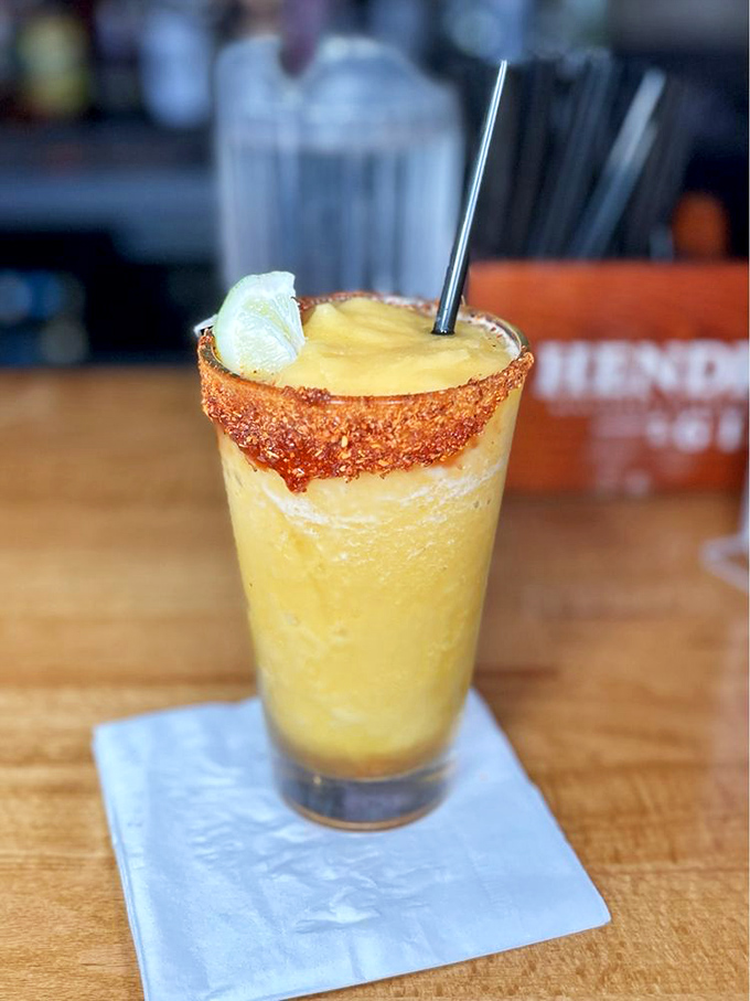 This mango margarita with its tajin rim is basically California sunshine in a glass—sweet, tangy, and impossible to sip slowly.