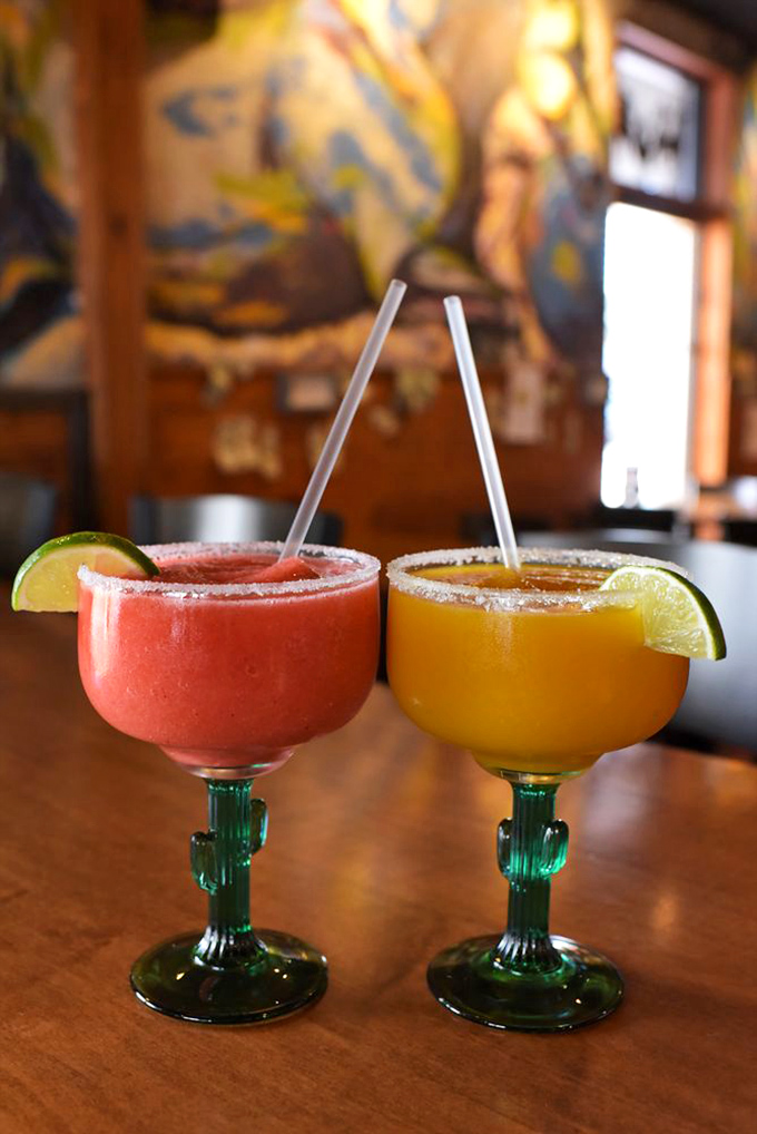 Margaritas with cactus-stem glasses? Someone understood the assignment. These aren't just drinks; they're vacation in a glass.