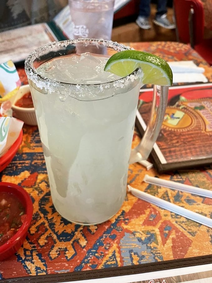 A proper margarita: salt-rimmed, lime-adorned, and large enough to make you forget you ever worried about anything.