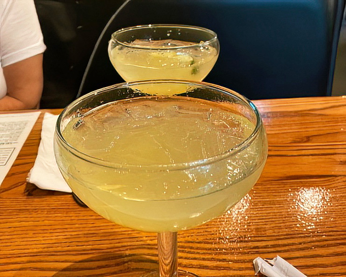These margaritas aren't just drinks; they're liquid sunshine in glassware that makes Monday feel like Saturday and stress feel like a distant memory.