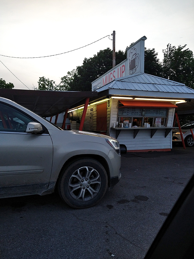 As the sun sets, Mugs-Up transforms from mere drive-in to glowing beacon of comfort food. Magic hour indeed.
