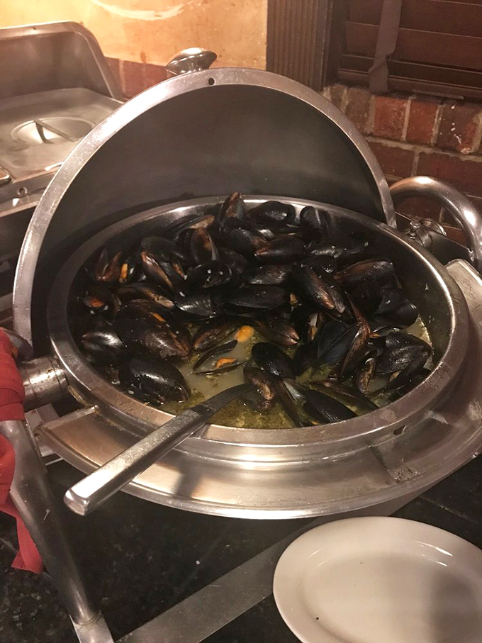 A pot of mussels steaming in their own briny glory—nature's perfect appetizer. Each one is like opening a tiny gift from the sea.