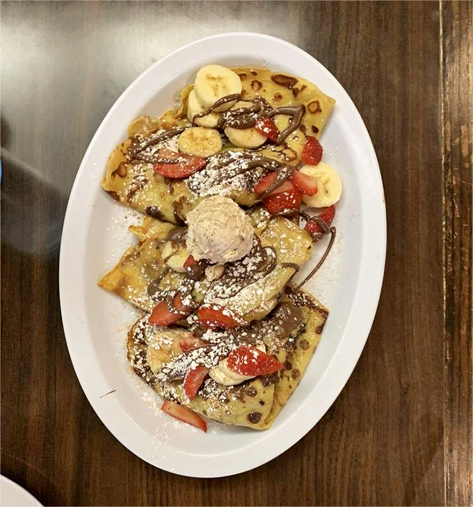 These crepes are having an identity crisis between breakfast and dessert, and honestly, we're here for it. Fresh fruit and chocolate drizzle make everything better.