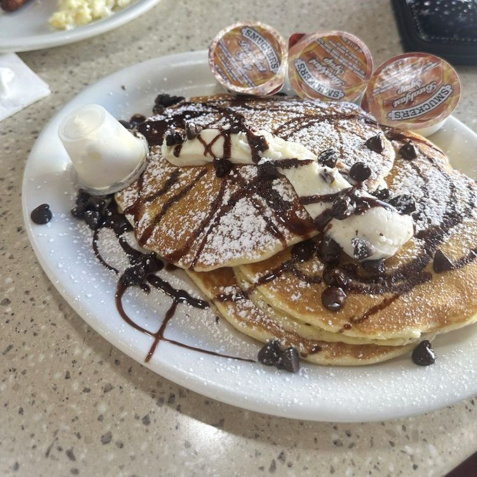 Nutella pancakes topped with whipped cream and chocolate&mdash;because sometimes breakfast should feel like you're getting away with something.