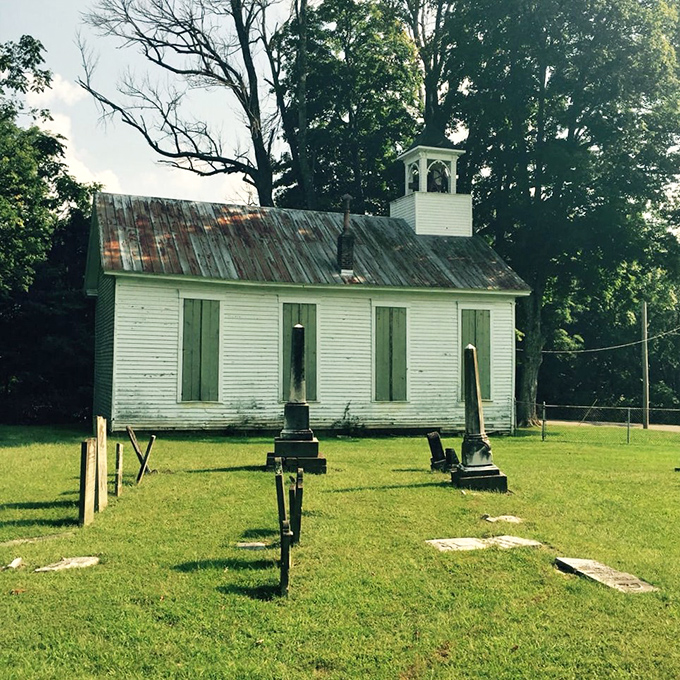 The historic Bethel Church stands as a time capsule, its weathered white boards holding Sunday sermons from another century.