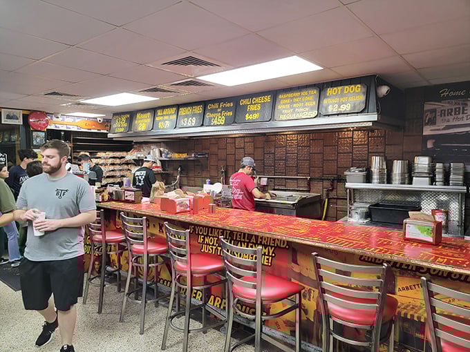 
The open kitchen reveals the choreography of hot dog artisans at work&mdash;no smoke, no mirrors, just honest-to-goodness food preparation. 