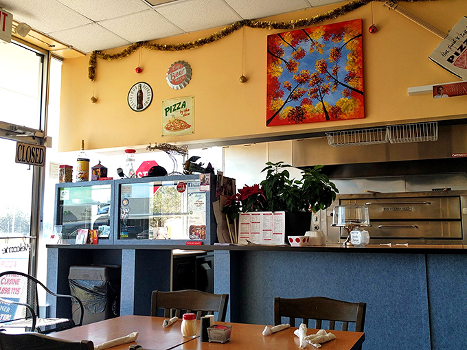 Where the magic happens. Simple counter, yellow walls, and a kitchen that's been turning out Italian-American classics for decades.