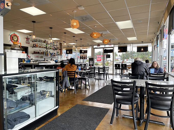 Where locals and tourists unite in the pursuit of fried seafood excellence. Those fish-shaped pendant lights? Just a hint of the ocean treasures below.